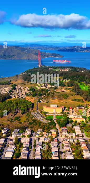 Coastal landscape with suspension bridge and cargo ship, San Francisco ...