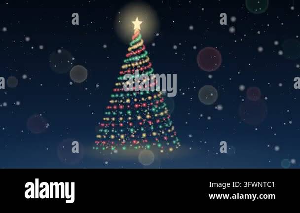 A decorated Christmas tree with red green gold ornaments and a glowing ...