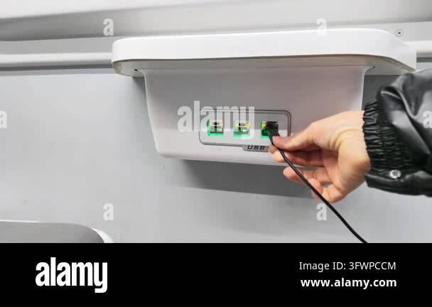 Charging phone using USB outlet inside train compartment. charge ...