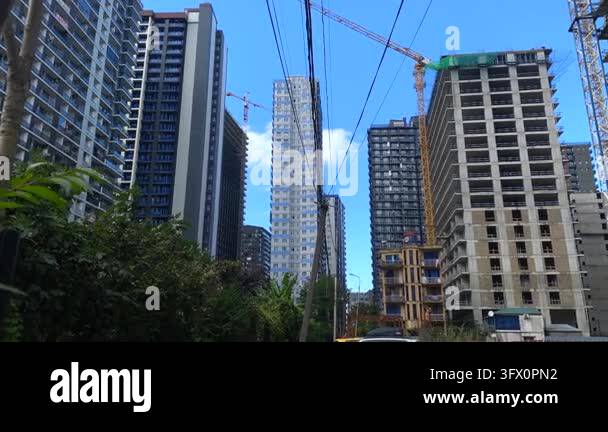 Camera pans across high-rise construction in Batumi, Georgia, showing ...