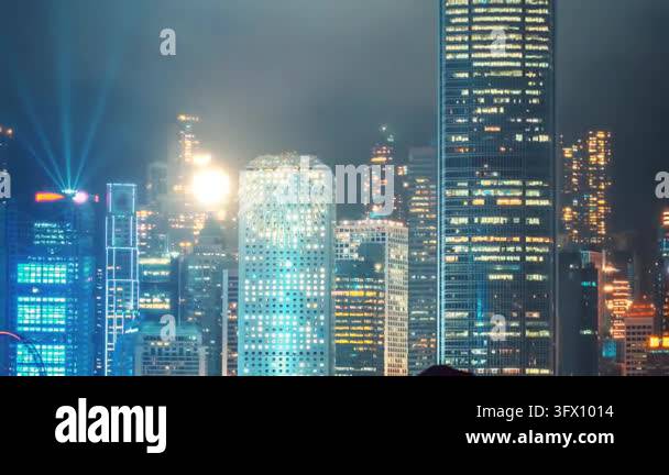 A wide shot of a vibrant cityscape at night featuring towering ...
