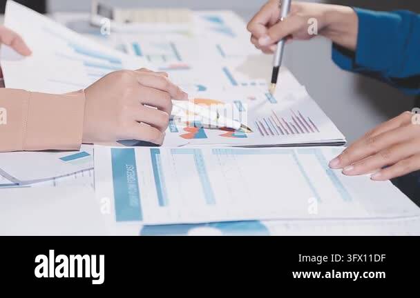 business team working together on a desk Stock Video Footage - Alamy