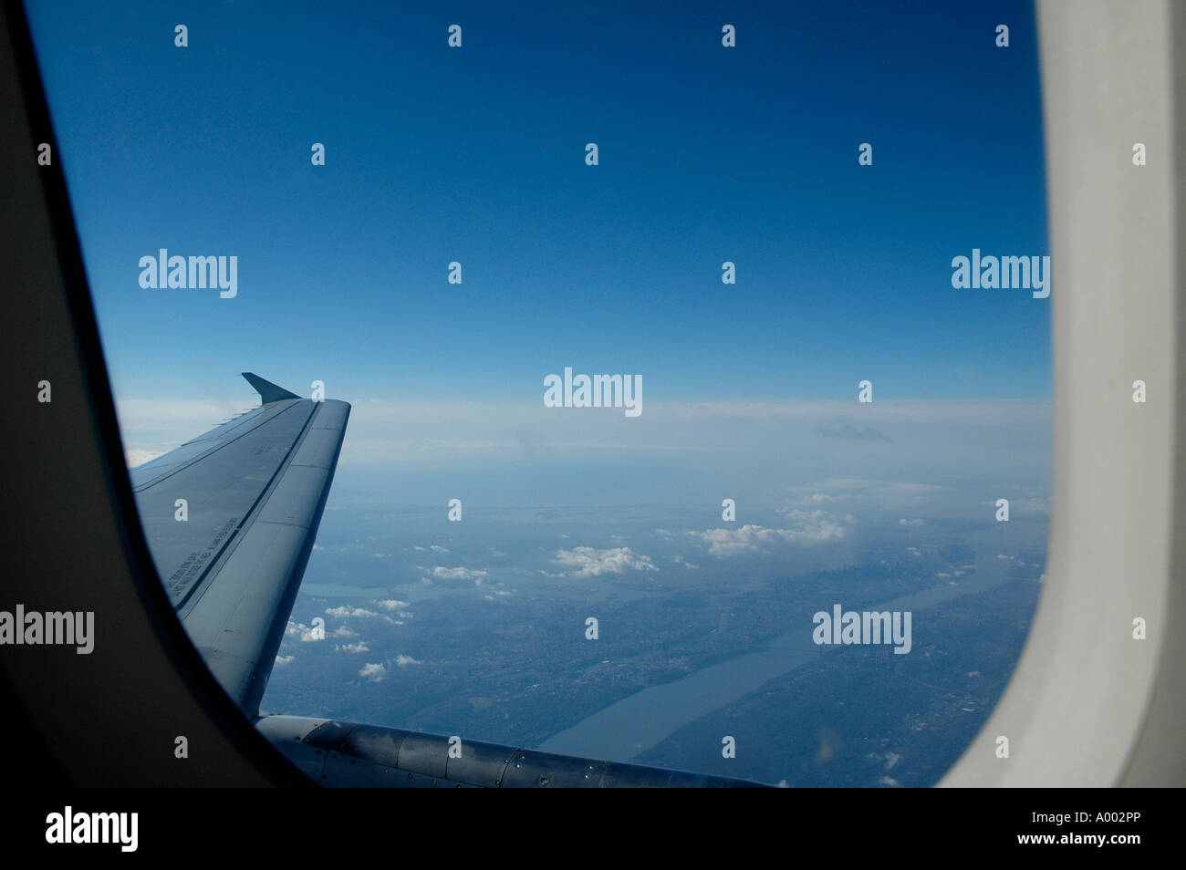 Wing from airplane window Stock Photo - Alamy