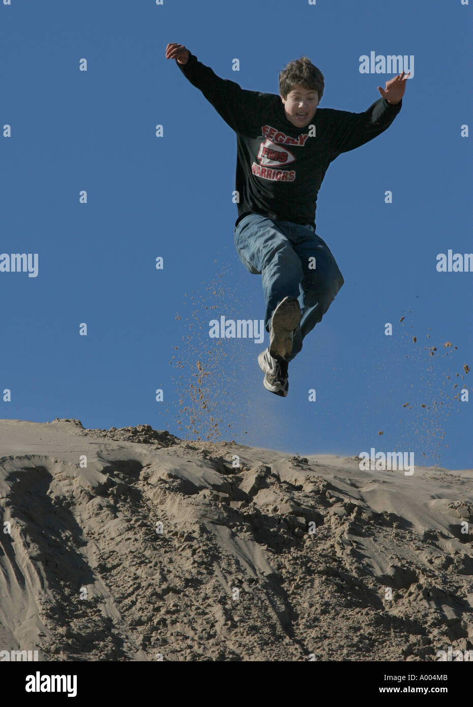 Teen jumping off dune Indiana Dunes national lake shore Stock Photo - Alamy