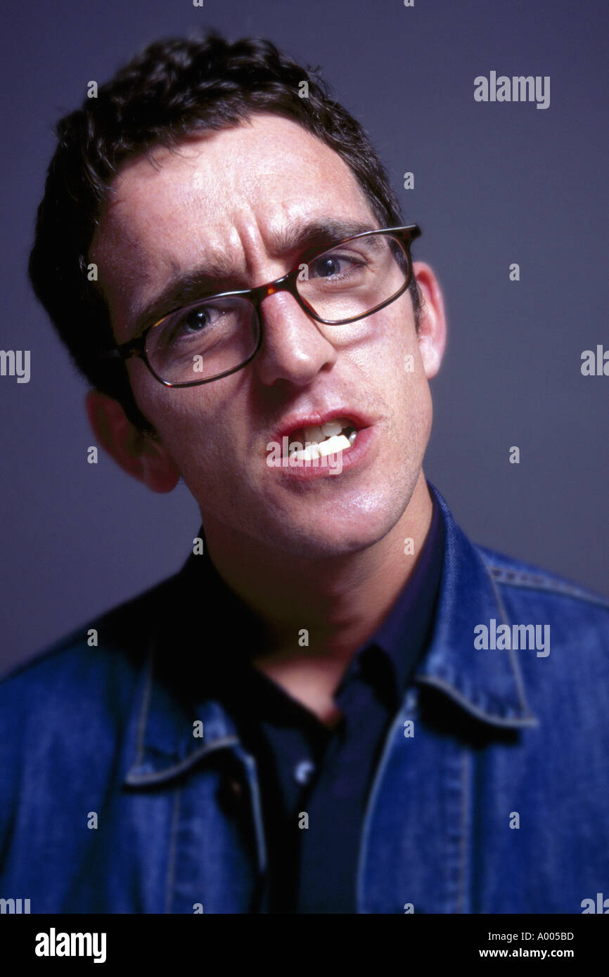 Man gritting teeth Stock Photo - Alamy