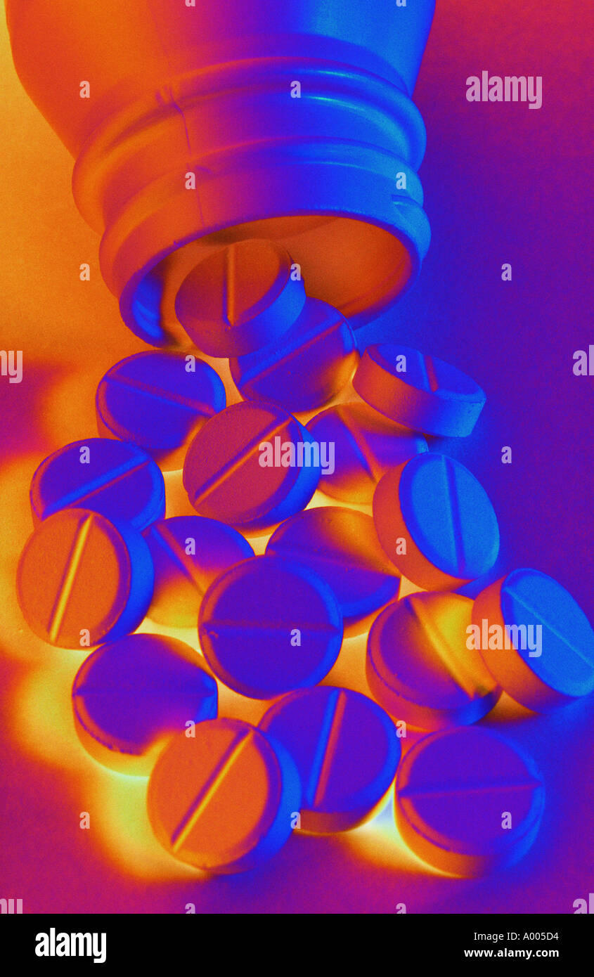 Drugs pouring from bottle Stock Photo - Alamy