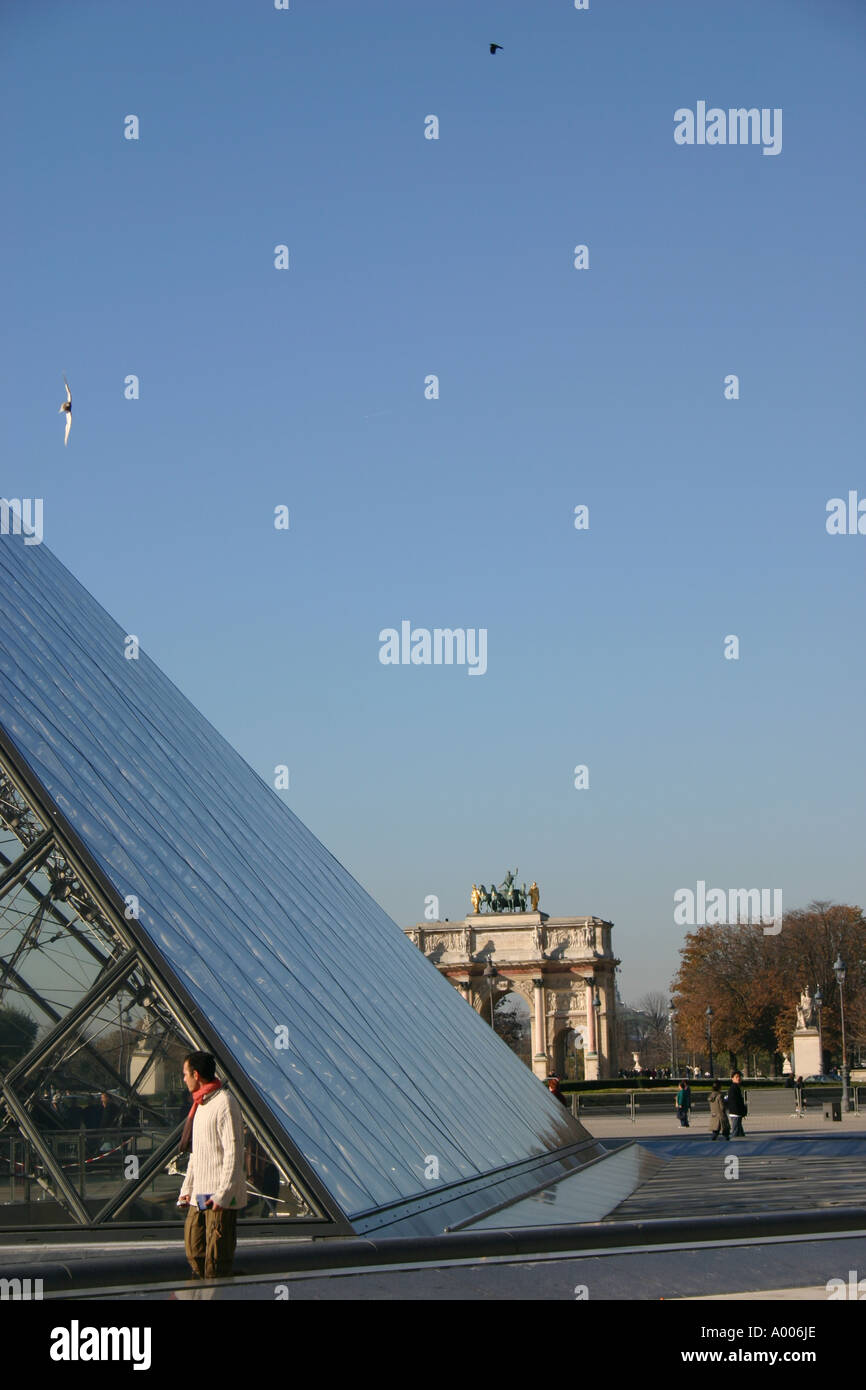 Glass pyramid at the Louvre, Paris, France. Tuileries gardens in ...