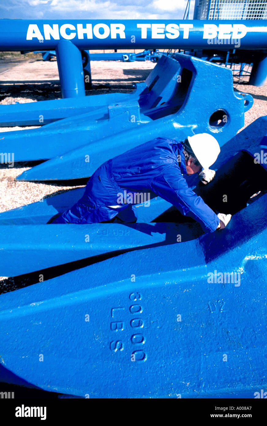 Blue Anchors being Inspected Stock Photo - Alamy