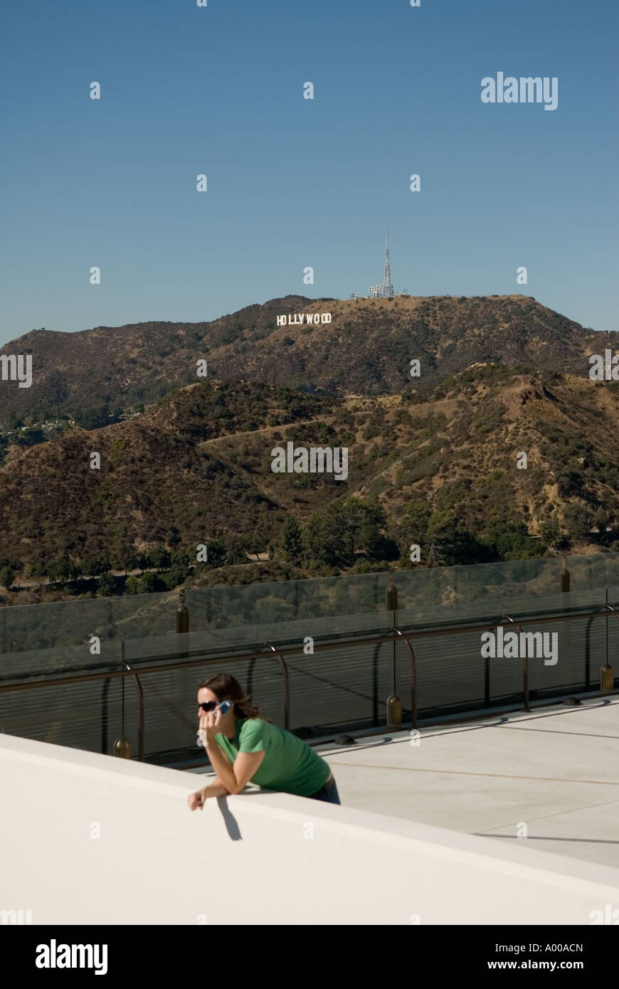 Young woman on a cell phone in balcony at the Griffith Observatory, Los ...