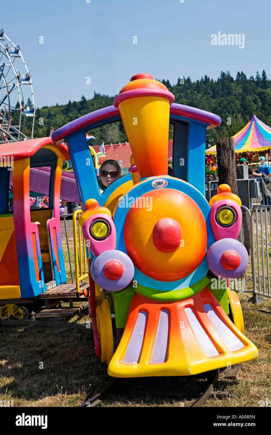 Image of a young girl riding in the front engine and looking out the ...