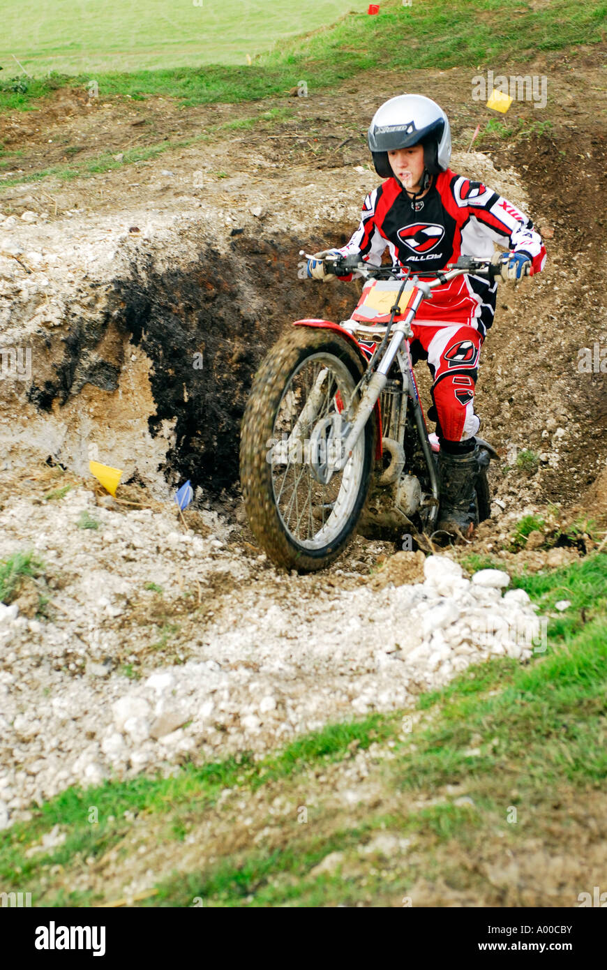motorcycle trials rider negotiating tricky section of course on ...