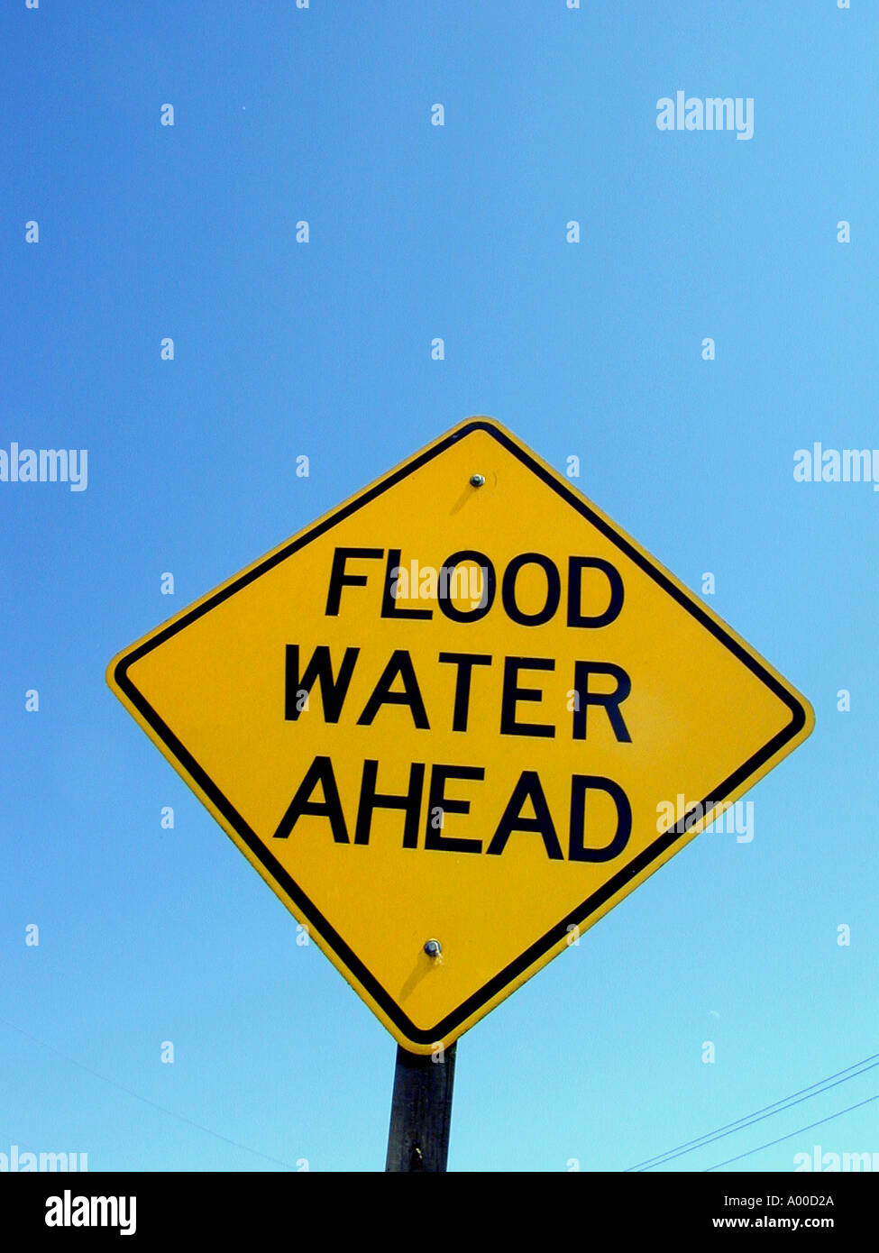 Caution sign warning of flooding on highway Stock Photo - Alamy