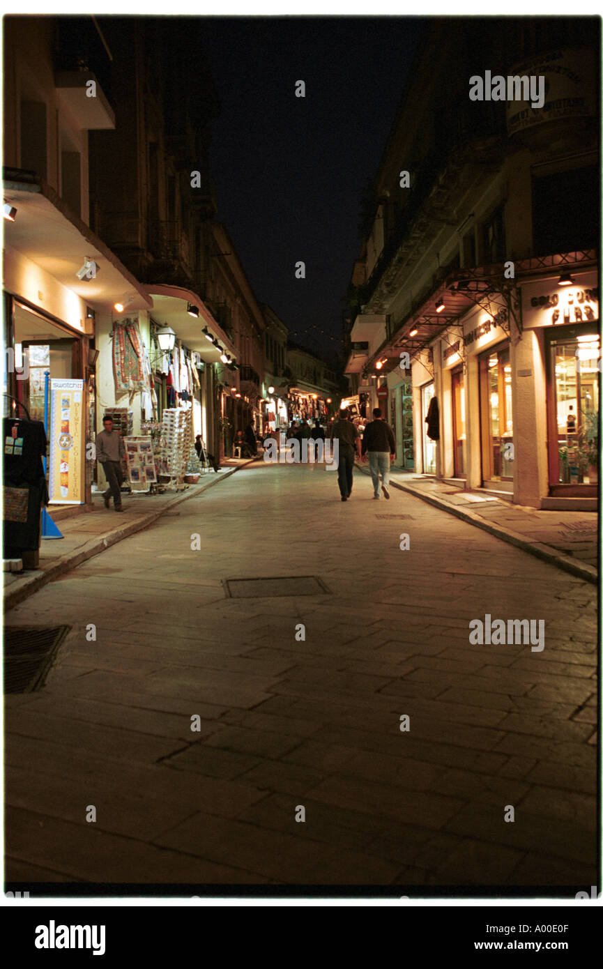 A night time street scene of the shopping district in Athens Greece ...