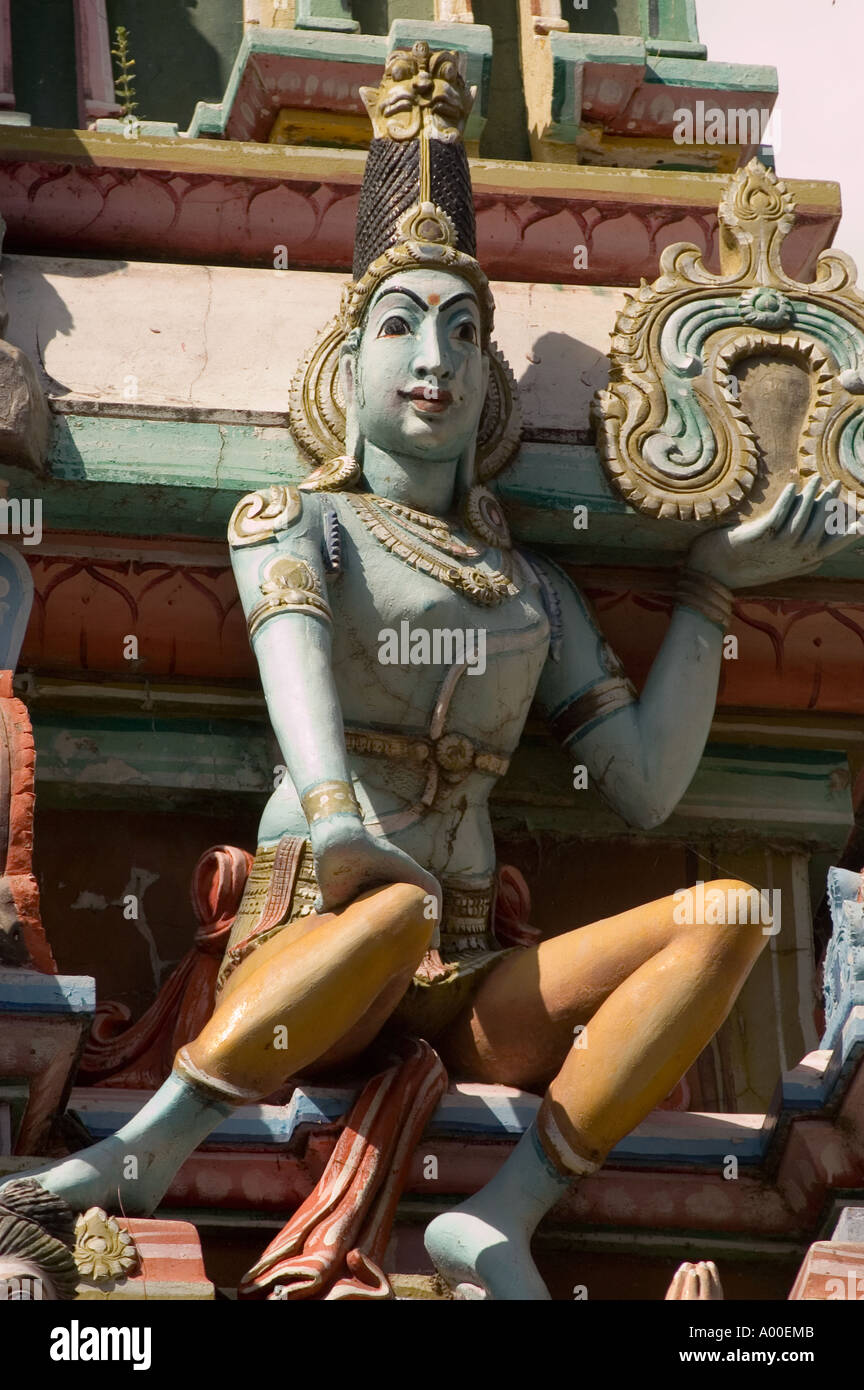 Close up of blue Hindu male deity statue at street temple in Varanasi ...