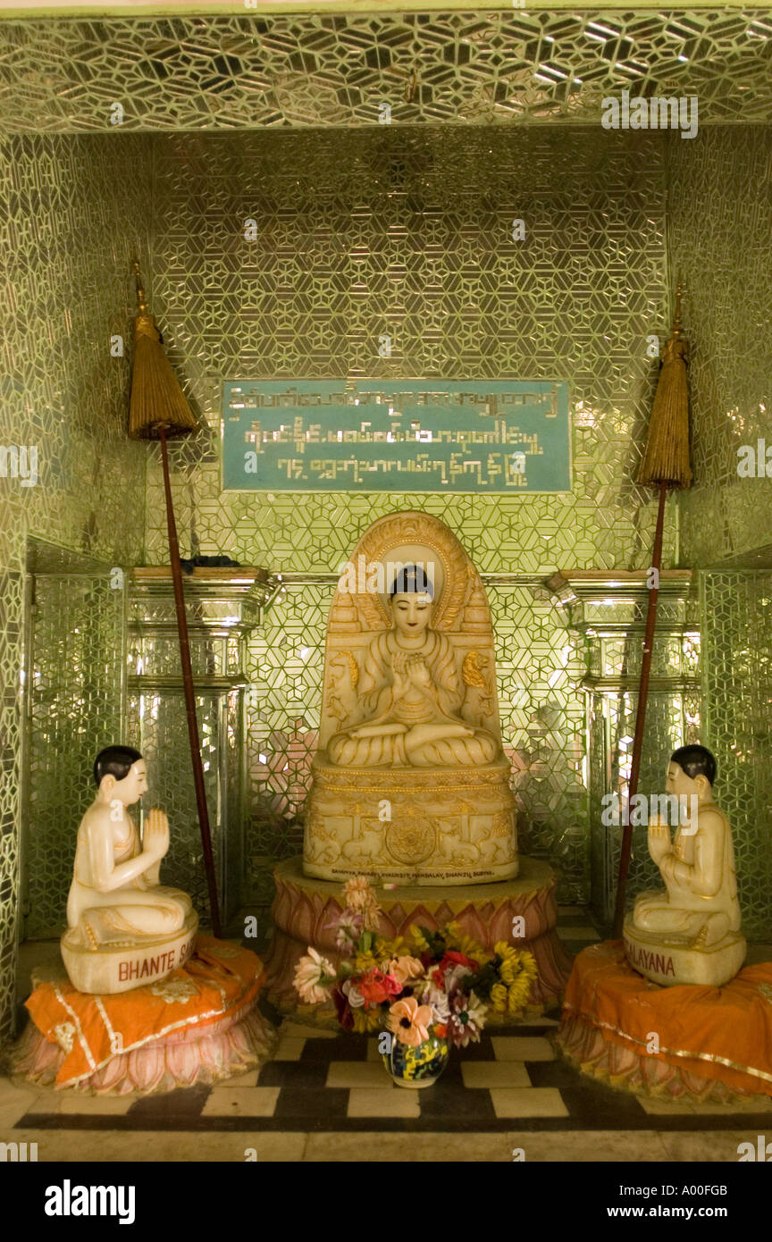 Burmese style buddhist altair with statues of Buddha Sariputtra ...