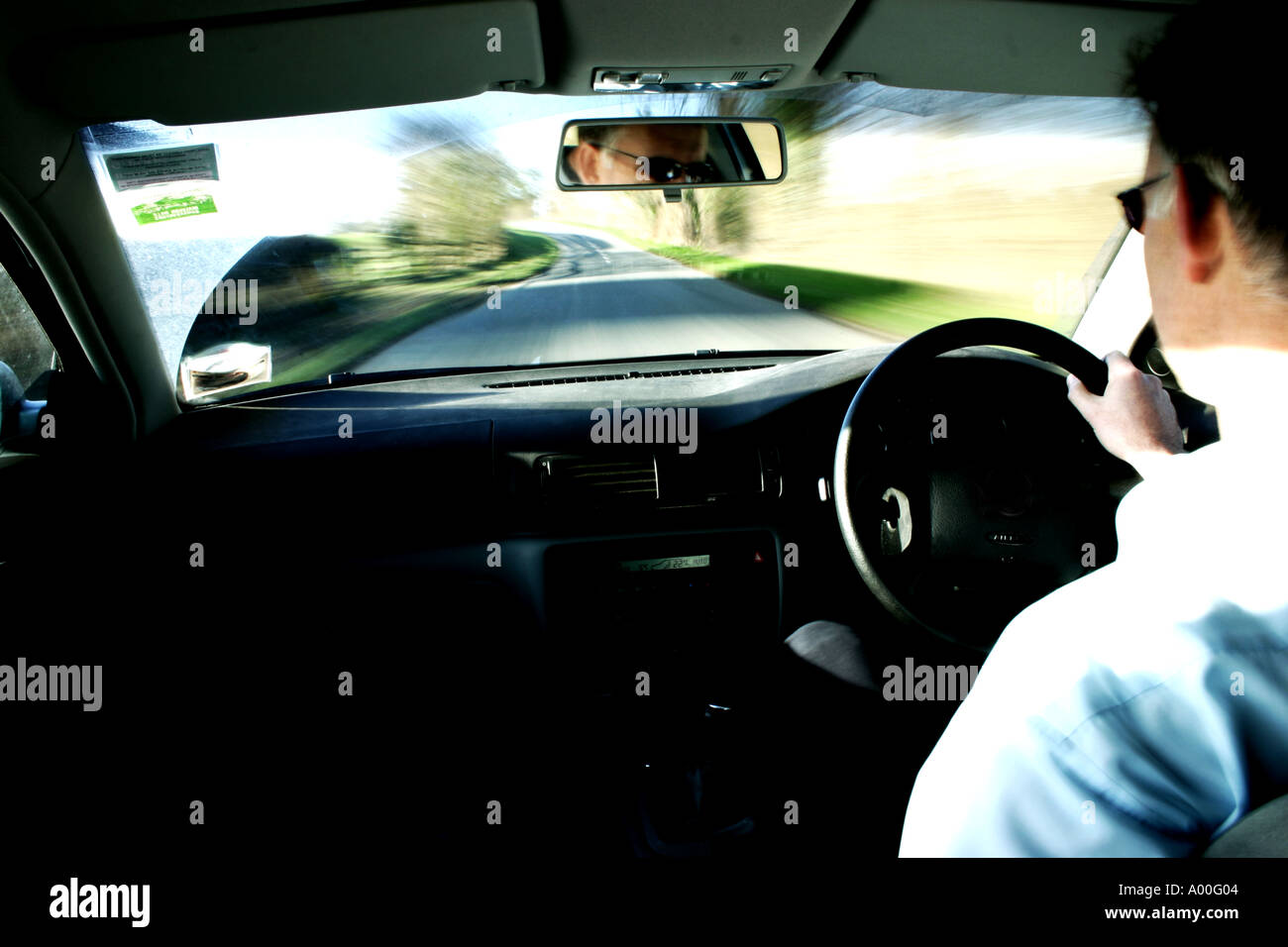 Driver speeding down country road hi-res stock photography and images ...