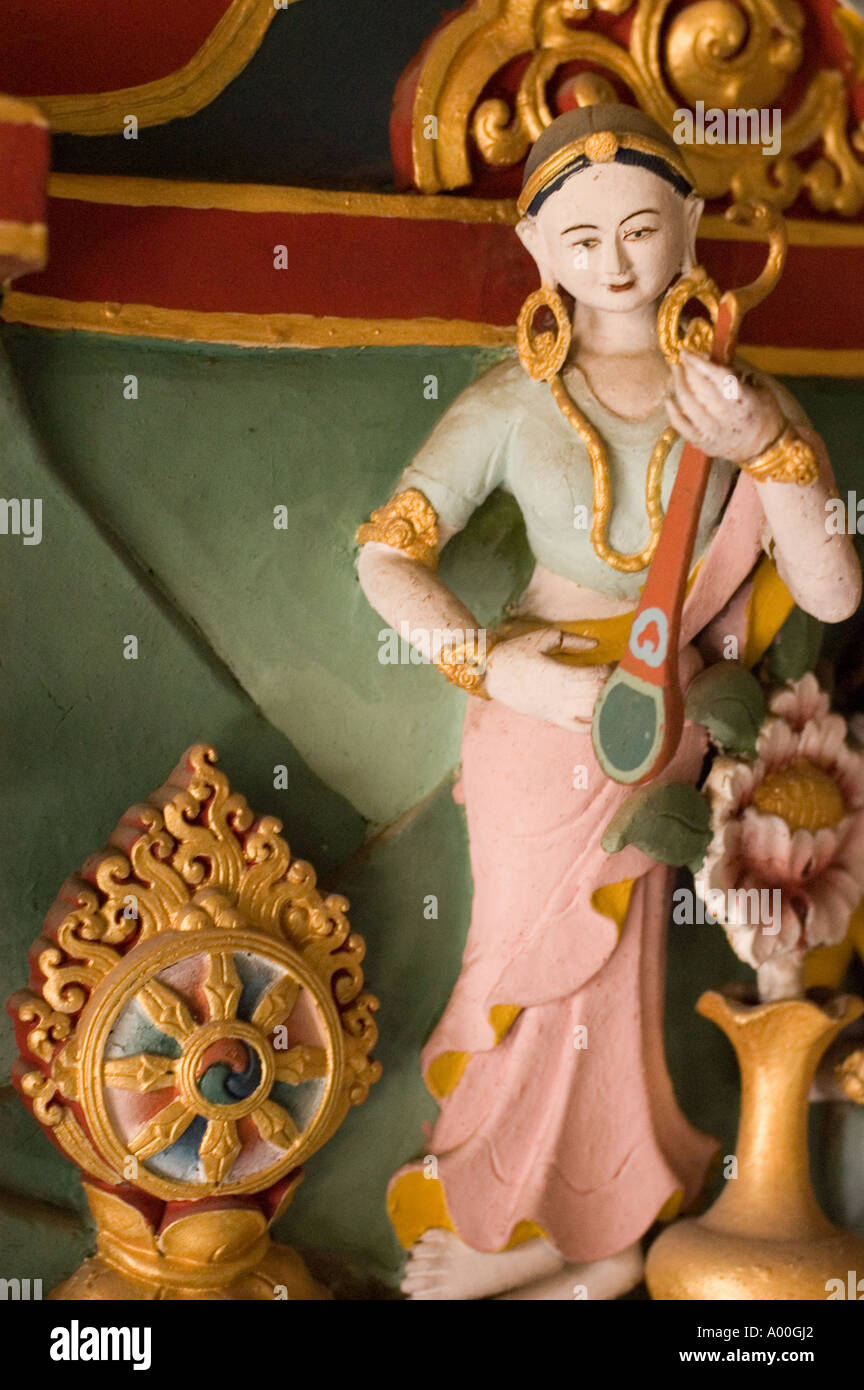 Girl playing string musical instrument bas relief in Royal Bhutanese ...