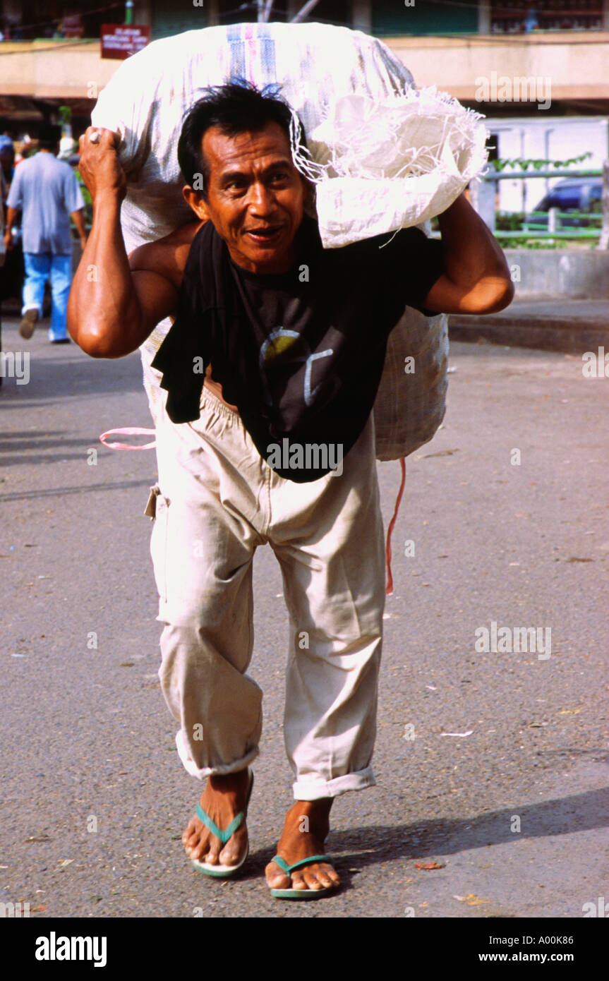 Man Carrying Heavy Load On Back High Resolution Stock Photography and ...