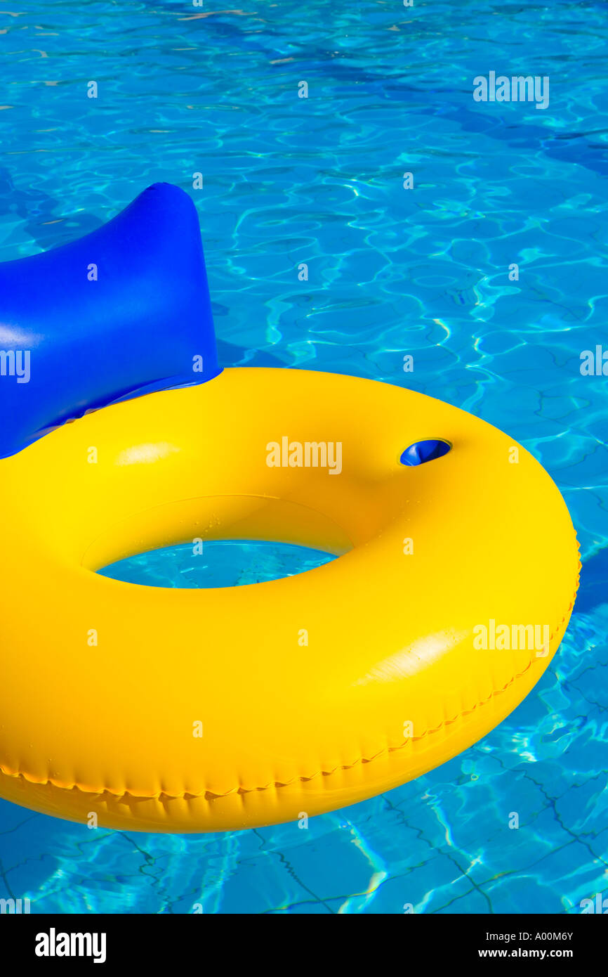RUBBER RING WITH BACKREST IN A SWIMMING POOL Stock Photo - Alamy