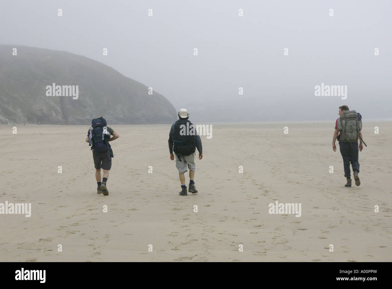 Group of ramblers enjoying walking holiday on the Cornish Coastal Path ...