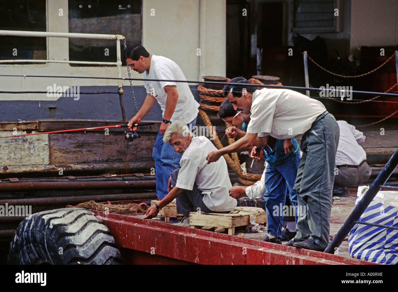 Turkish men fishing off a dock Istanbul Turkey Stock Photo - Alamy