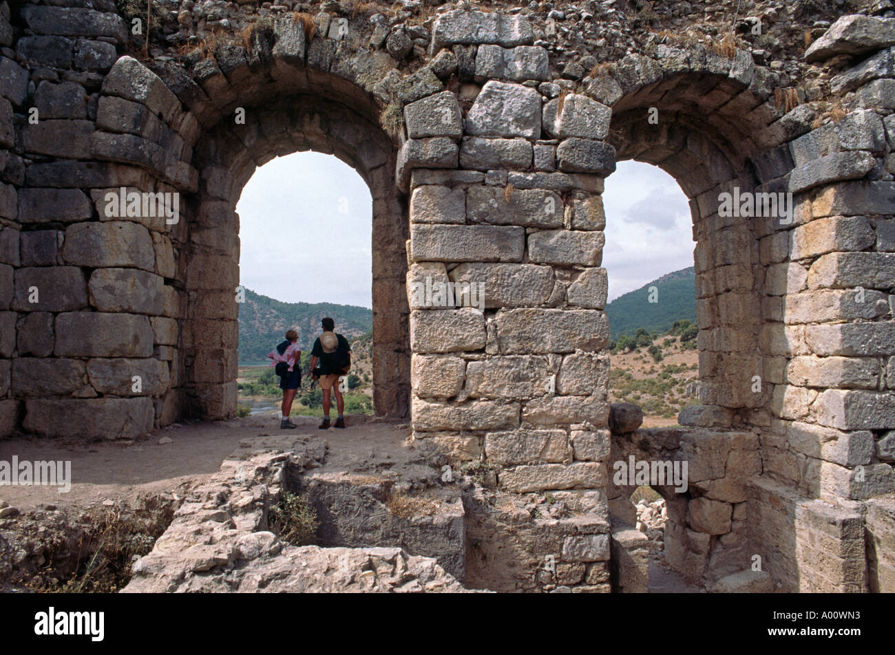 Travelers visit the Byzantine Basilica at The Ruins of CAUNUS which ...