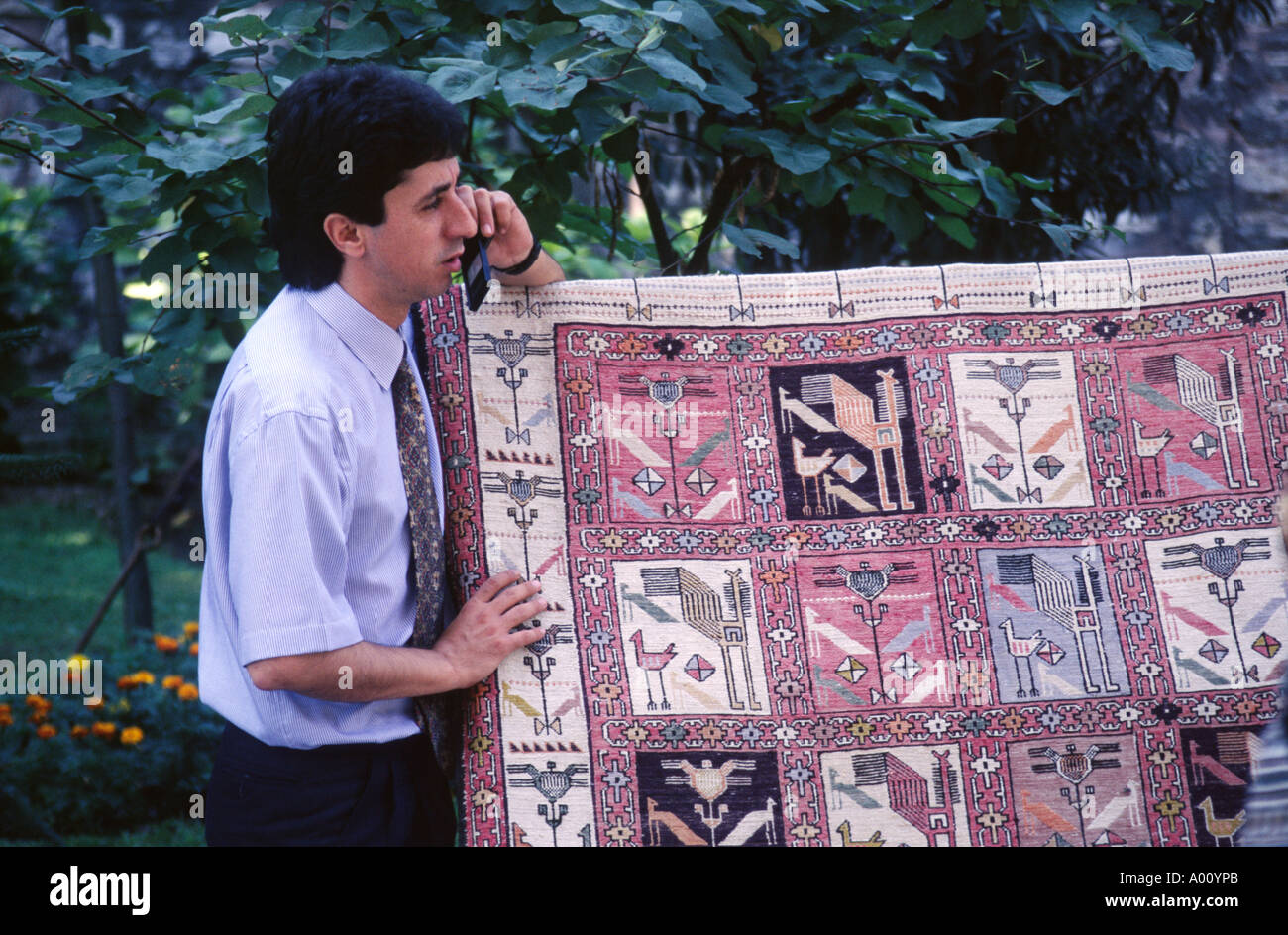 Turkish rug salesman uses his cellular phone Istanbul Stock Photo - Alamy