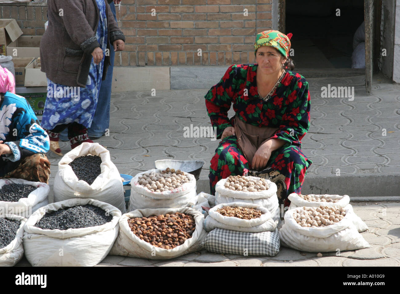 Nut and dried fruit seller in Samarkand bazaar Stock Photo - Alamy