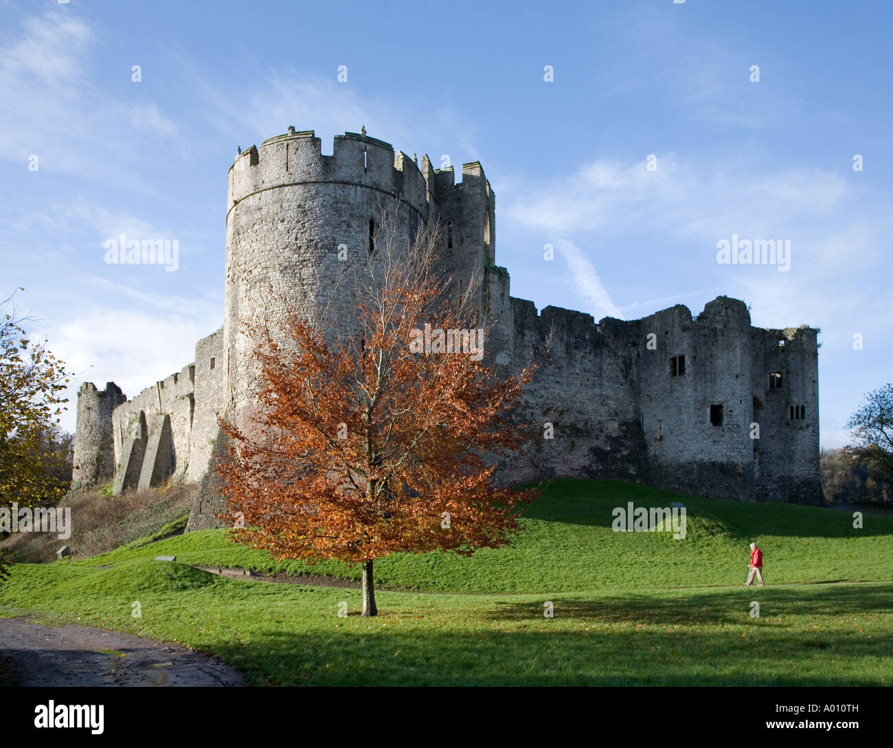 Man walking past the Outer Gatehouse and Marten s Tower Chepstow Castle ...