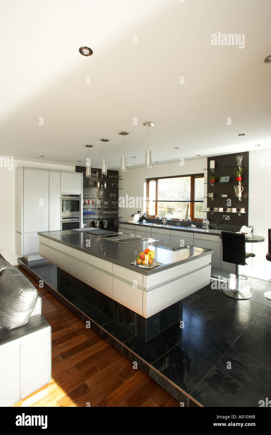 kitchen with central food preparation area in modern house Stock Photo ...