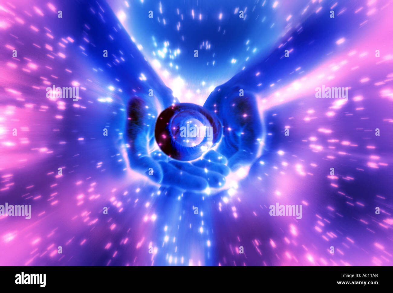 Hands holding purple schell radiating energy Stock Photo - Alamy