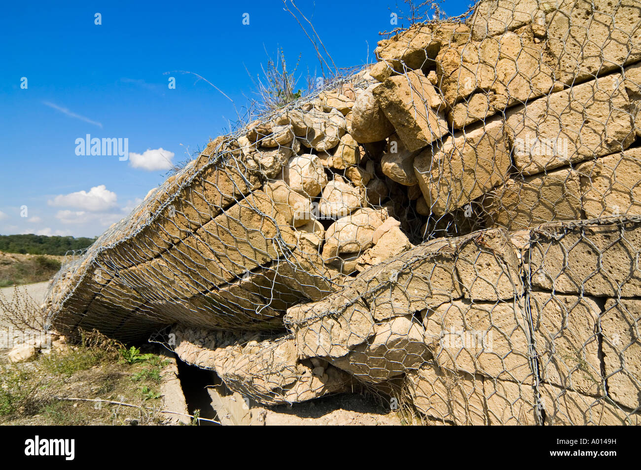 Crumbling tuff retaining wall Stock Photo - Alamy
