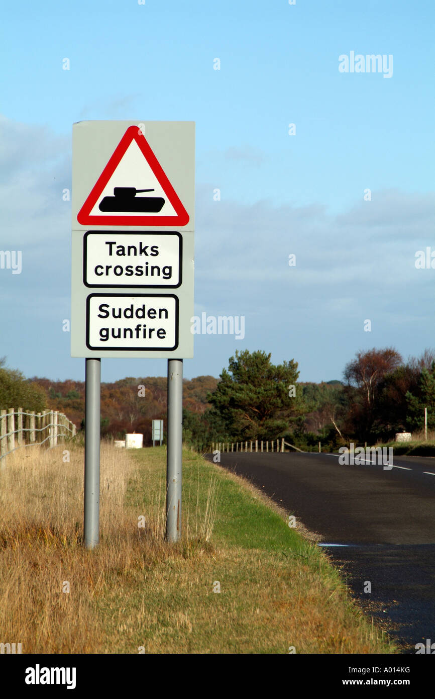 Warning road sign. Tanks crossing and sudden gunfire Stock Photo - Alamy