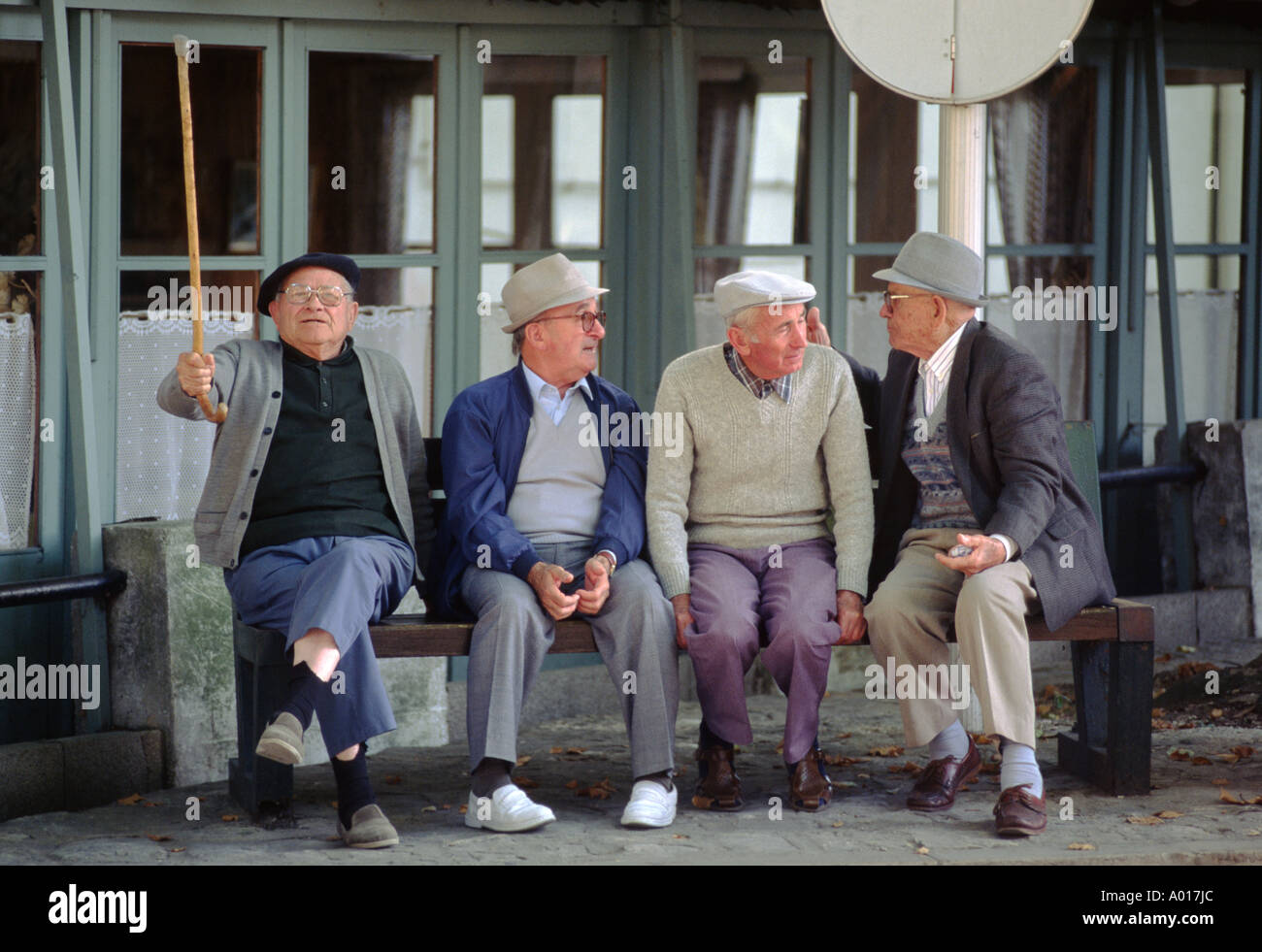 Four Frenchman share a park bench PROVENCE FRANCE Stock Photo - Alamy