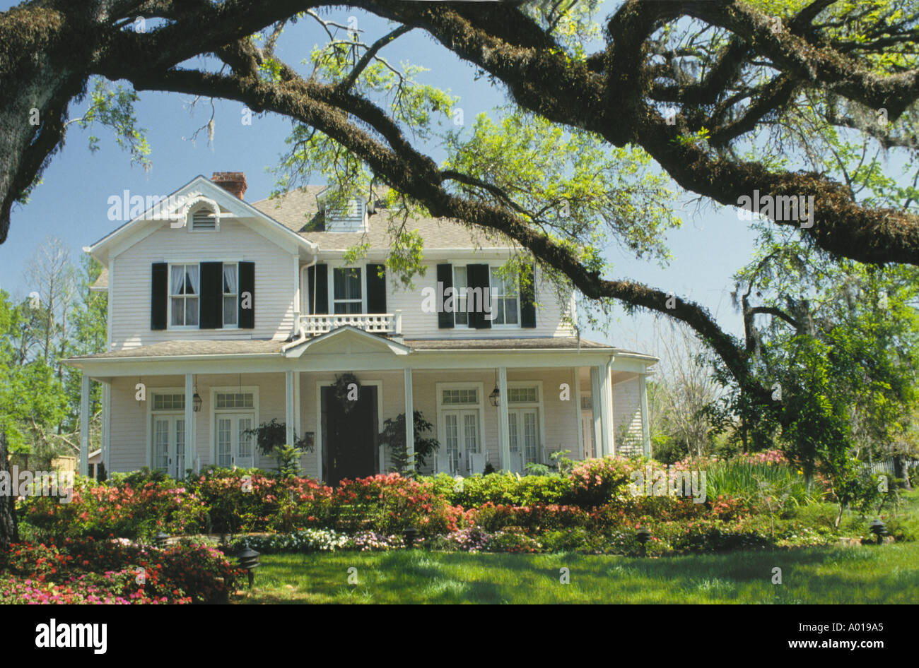 Large high end Victorian style home with wide porches and landscaped ...