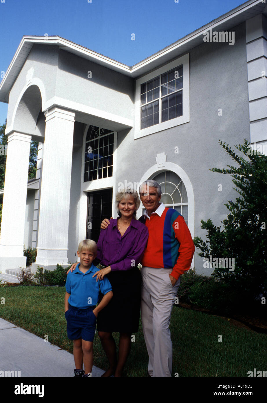 Real people Family portrait in front of expensive home Stock Photo - Alamy