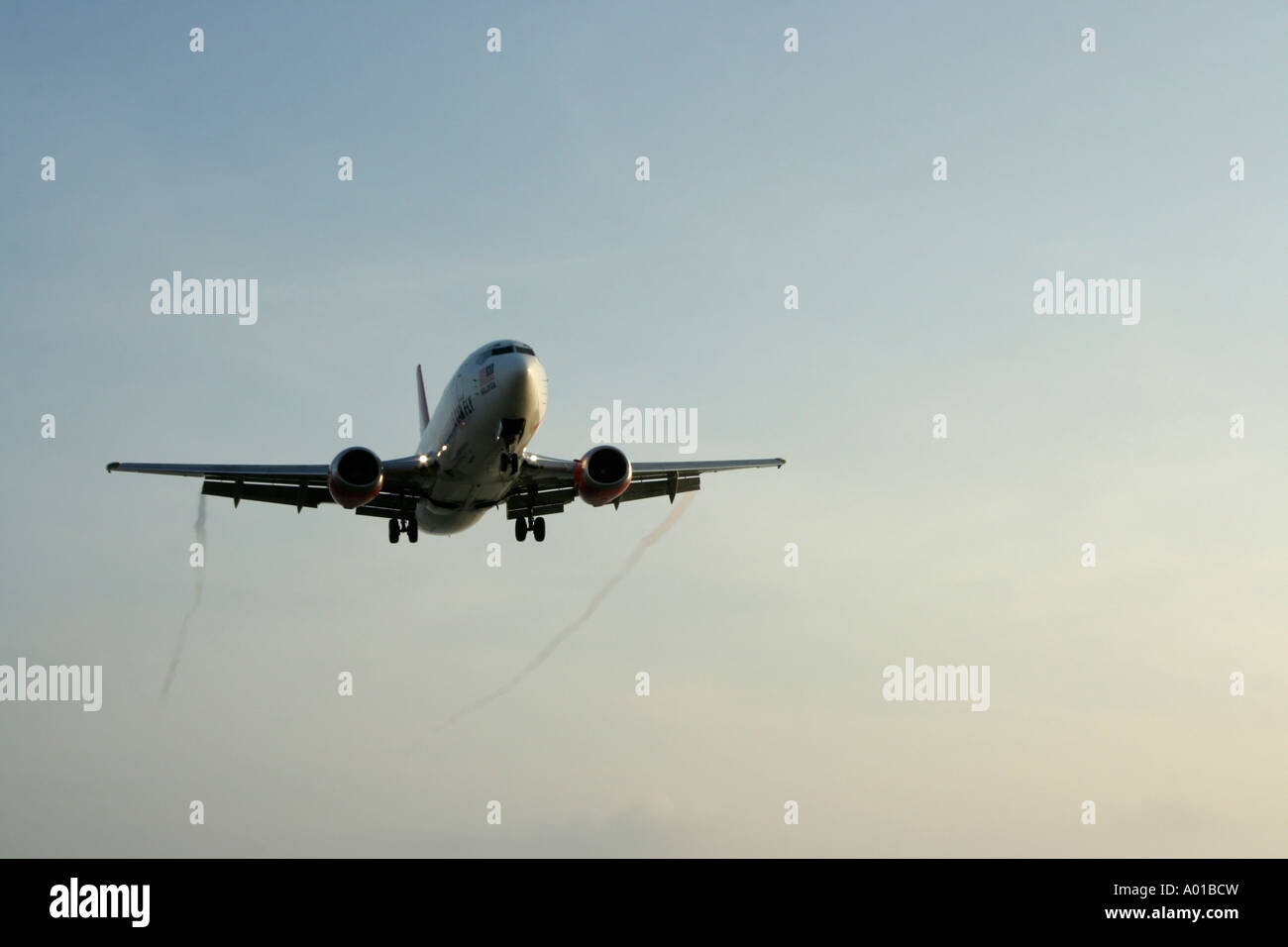 An airplane about to land Stock Photo - Alamy
