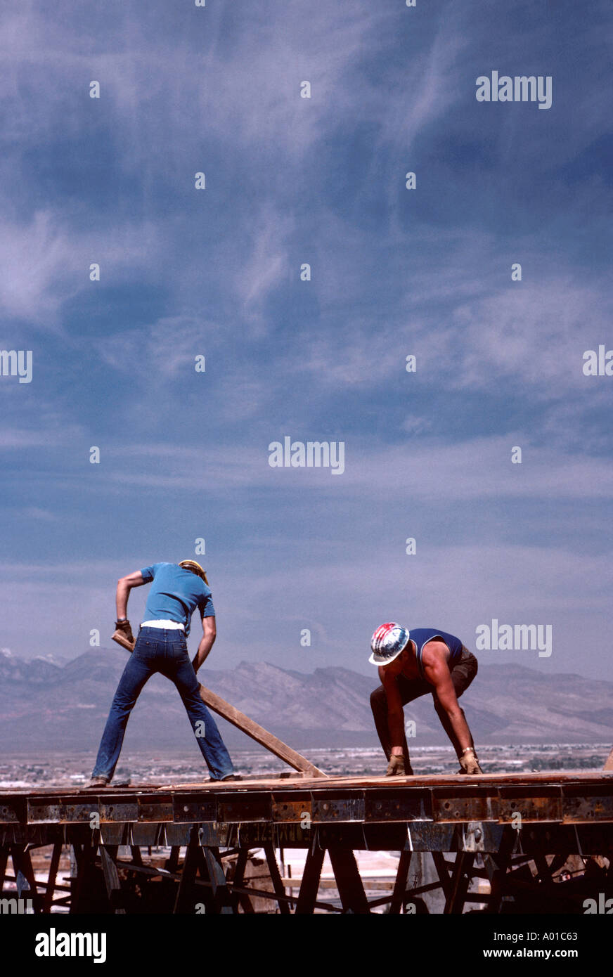 Construction workers on high rise building Stock Photo - Alamy