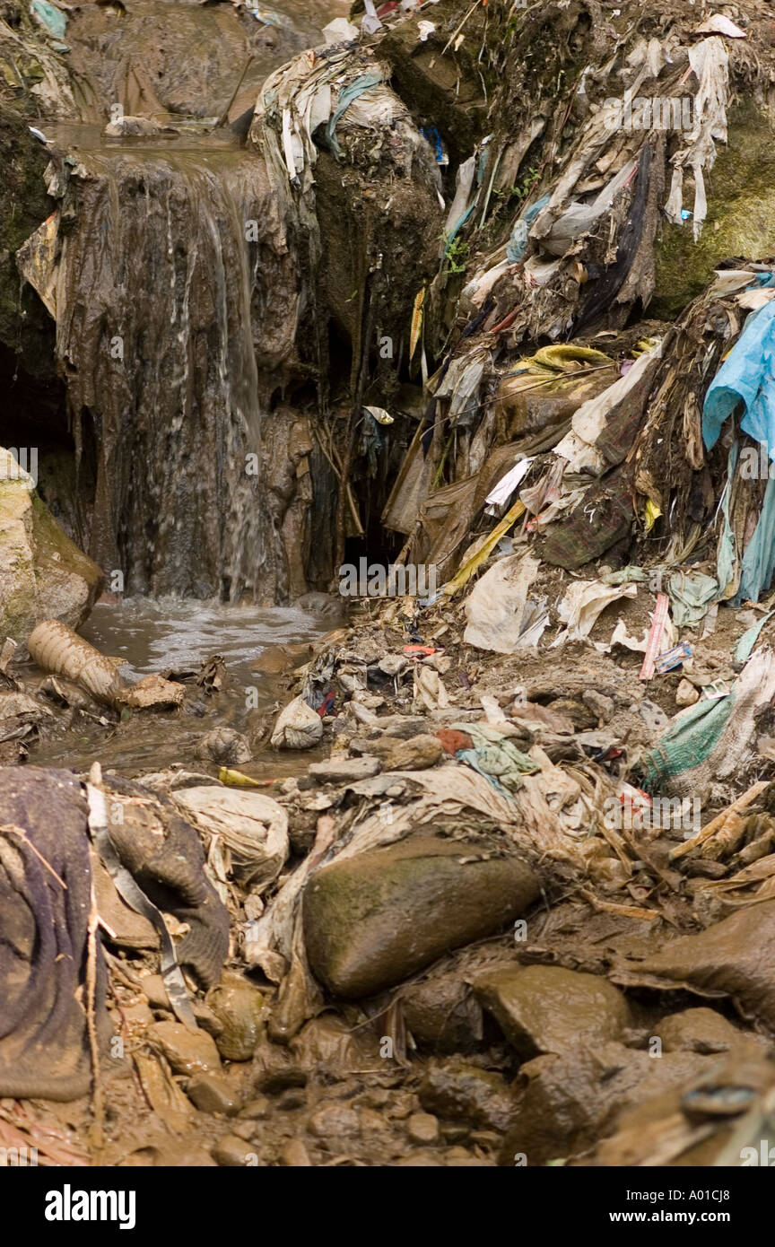 Dirty polluted water waste with junk plastic and old clothes big ...