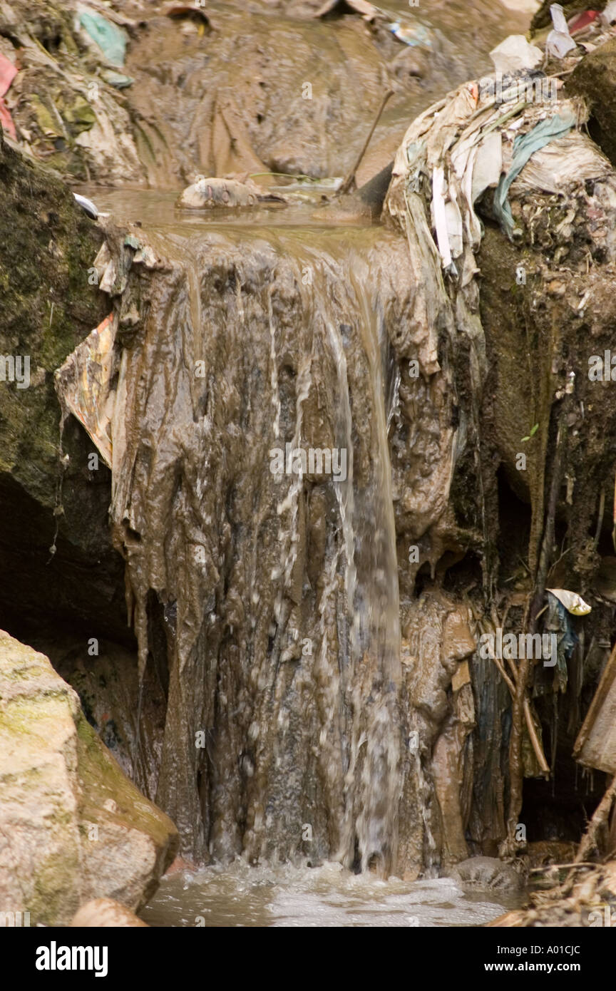 Dirty polluted water waste with junk plastic and old clothes big ...