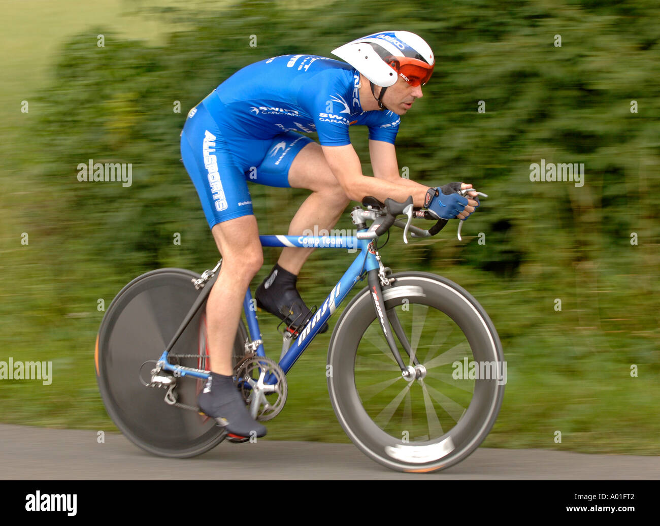 Cyclist competing in a road race time trial Stock Photo - Alamy