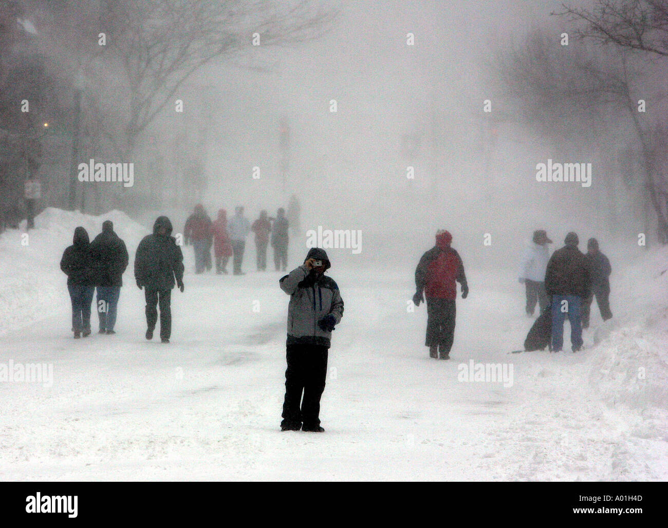 Pedestrians walk in the street during a winter storm in Boston Stock ...