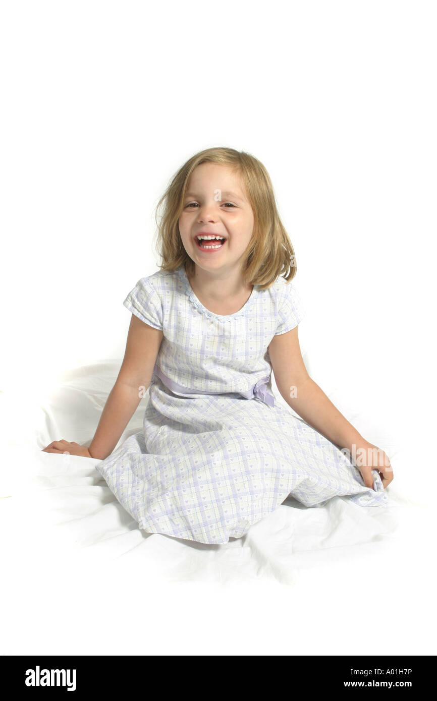 A full length portrait of a young girl sat looking away Stock Photo - Alamy