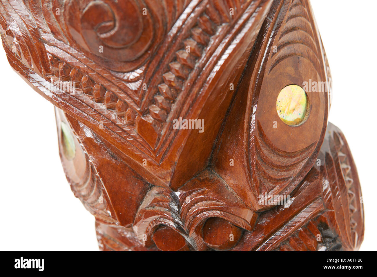 Maori wood carving eyes of Paua Stock Photo - Alamy