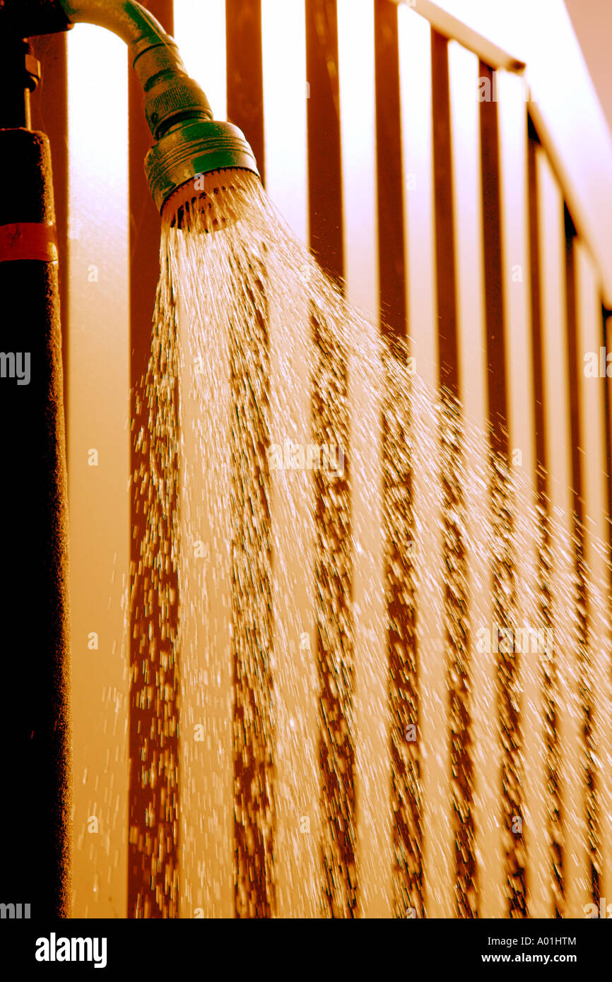 Warm Water public shower spray Stock Photo - Alamy