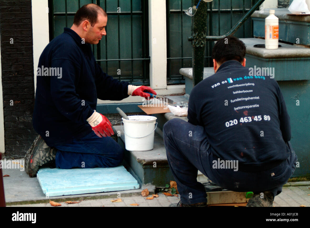 builder sat work Stock Photo - Alamy