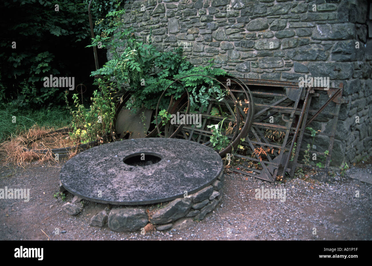 Farm gates and old mill stone Wales Stock Photo - Alamy