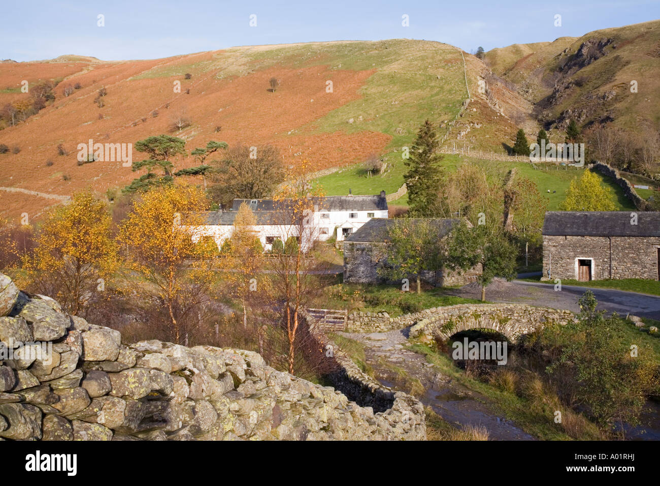 Old stone packhorse bridge over Watendlath beck in Lake District ...