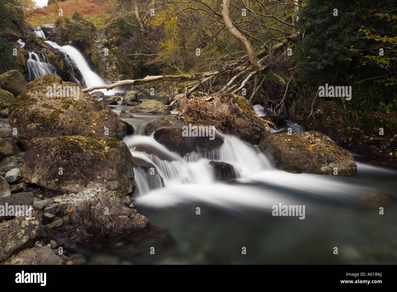 Waterfall and white water fast flowing over rocks in Mosedale Beck in ...