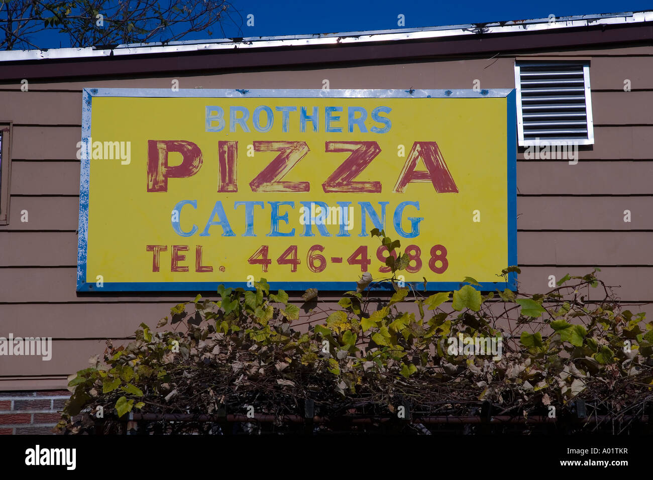 Sign on the side of a restaurant Stock Photo - Alamy
